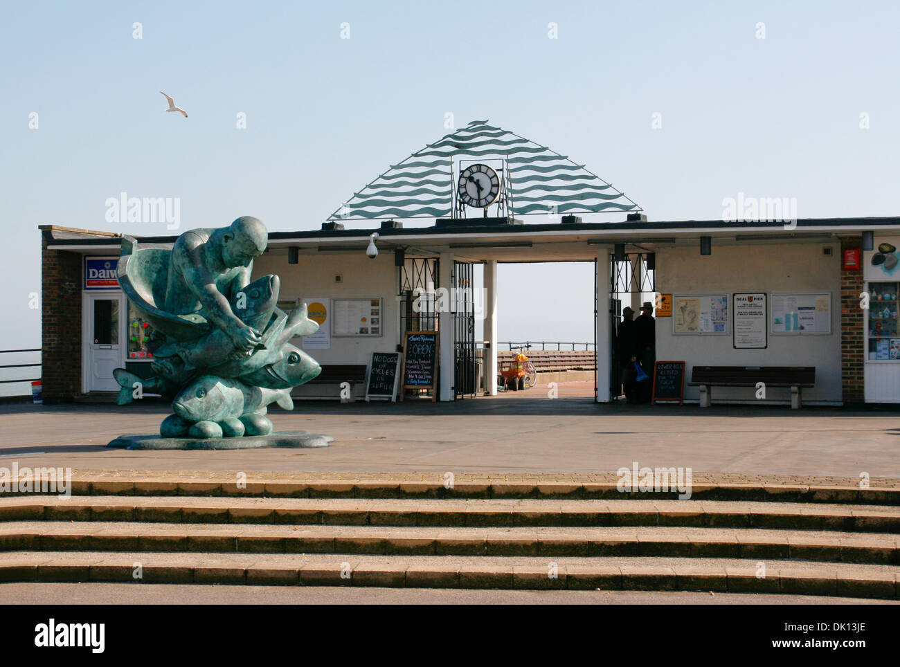 The entrance to Deal pier Kent with sculpturee by John Buck called ...