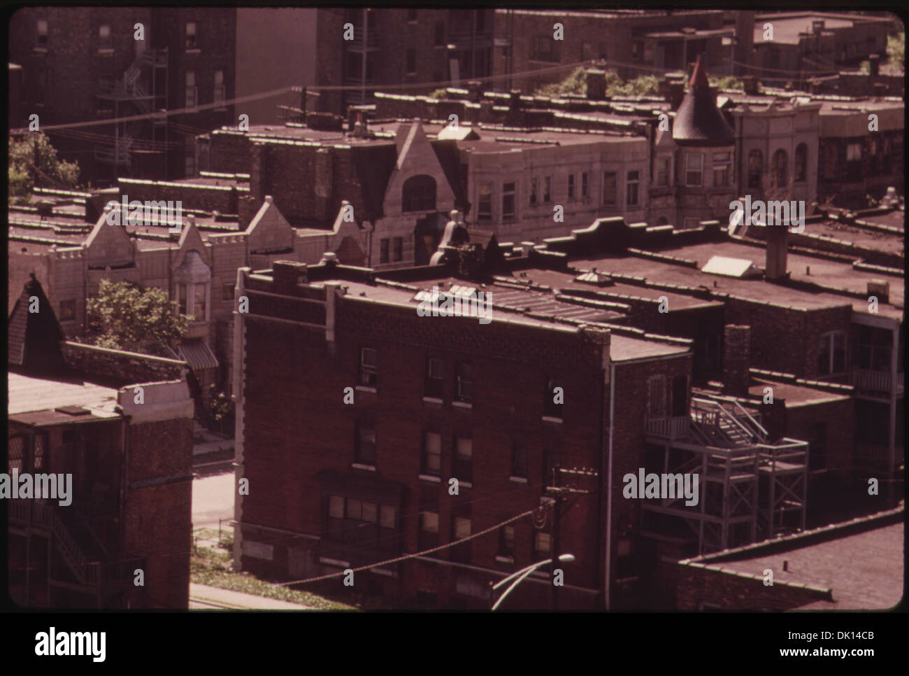 The photograph depicts older low-income apartments on the South Side of ...