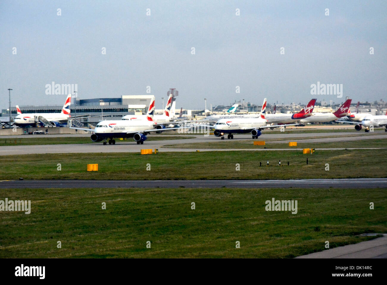 Line of aircraft waiting to take off from London heathrow on a busy ...