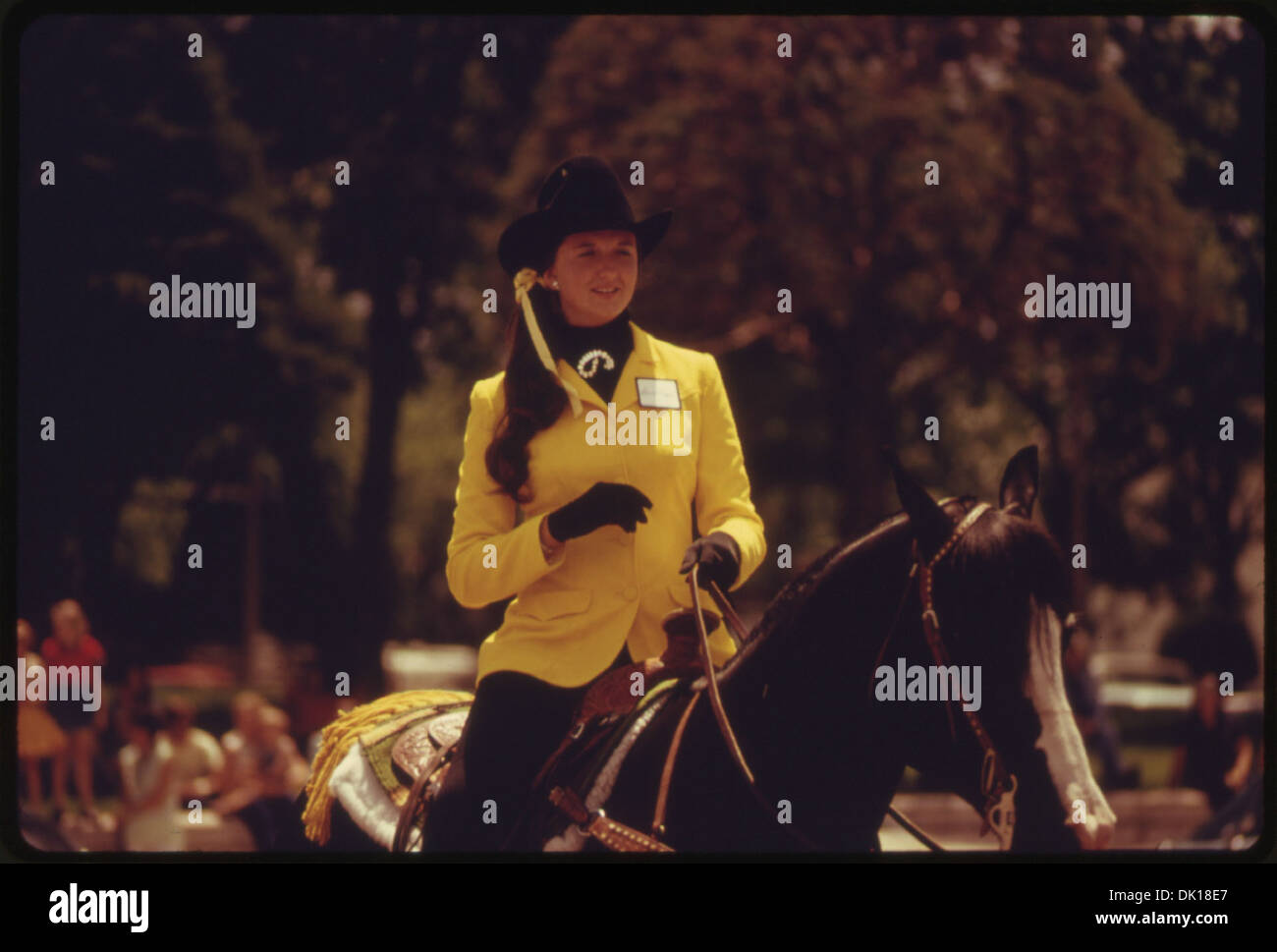 A rodeo queen rides horseback during a parade in Cottonwood Falls ...