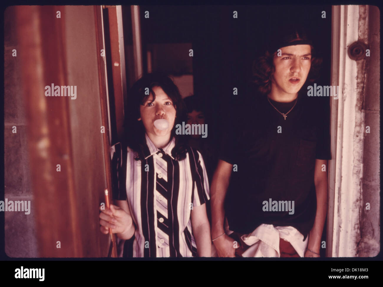 Sandy Watkins and his brother Billy stand at the front doorway of their ...