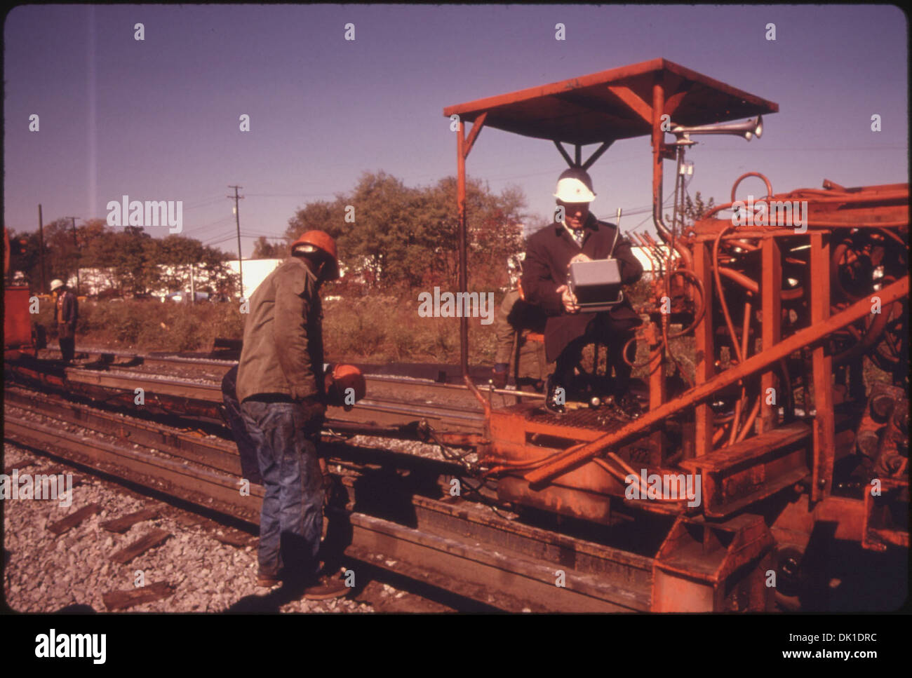 A work crew from Southern Railway is shown laying down new sections of ...