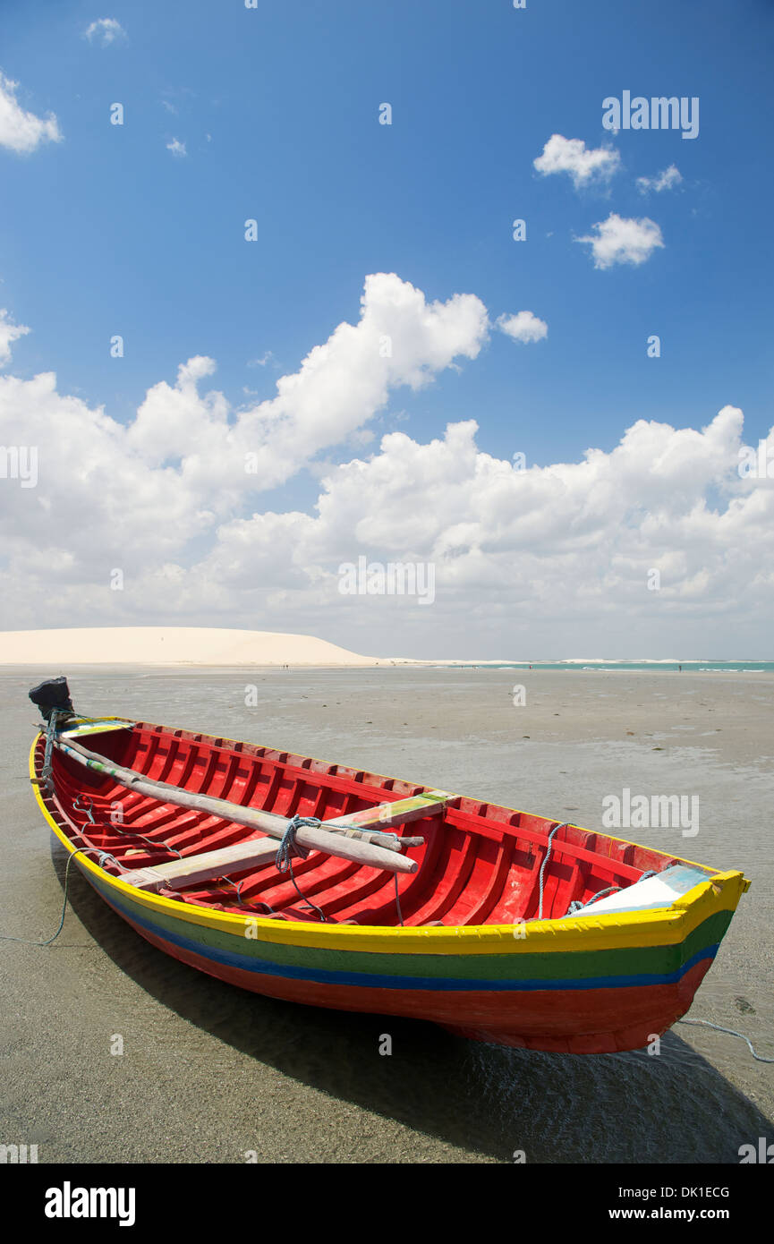 Traditional colorful Brazilian fishing boat on the beach in ...