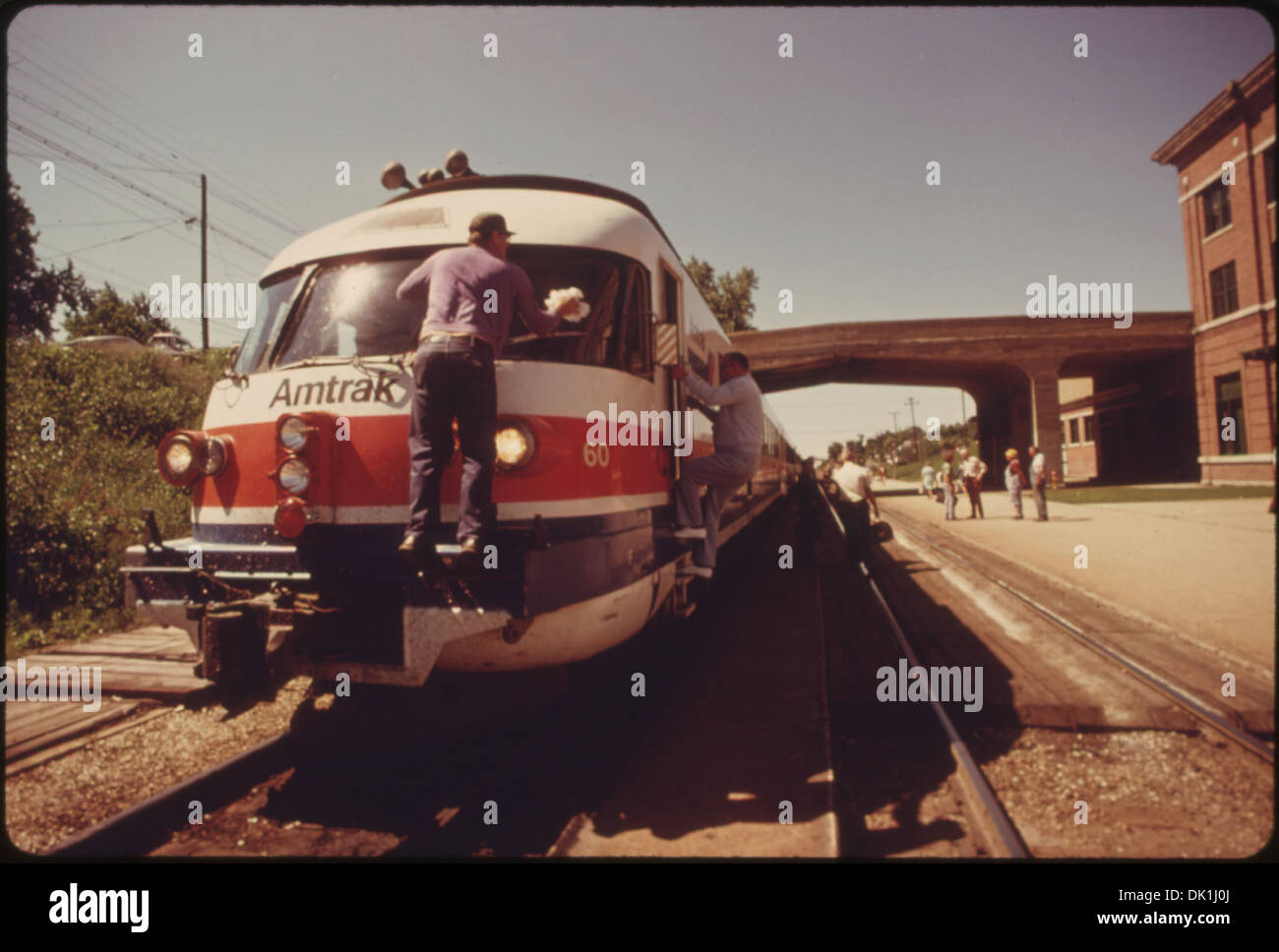 A Turboliner engine's windshield is cleaned as the passenger train ...