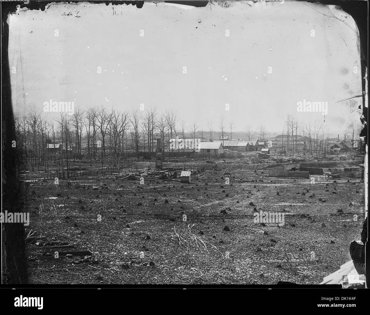 This photograph depicts a camp scene, showing the layout and ...