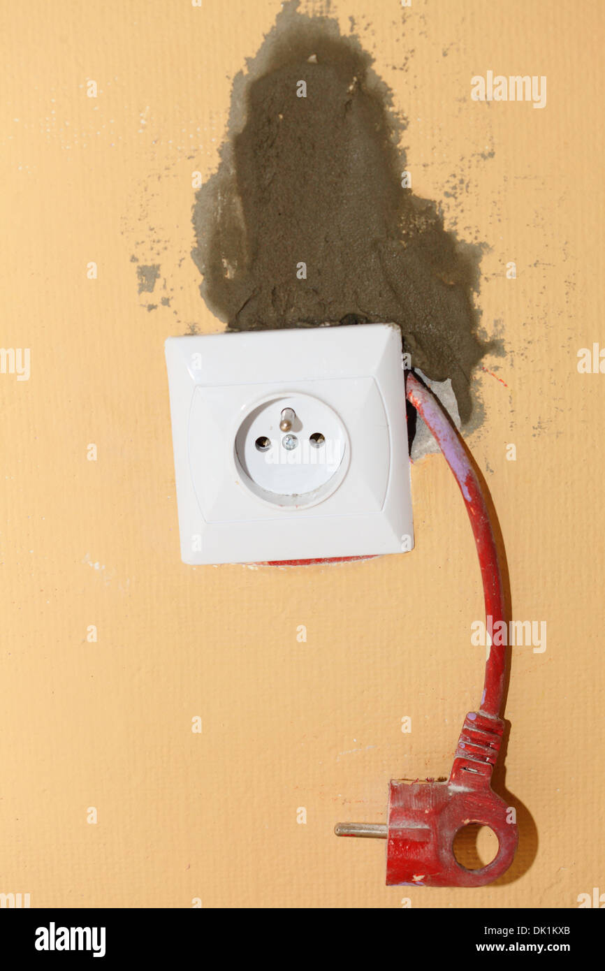 Outlet cord and plug. Electric socket in construction site Stock Photo ...
