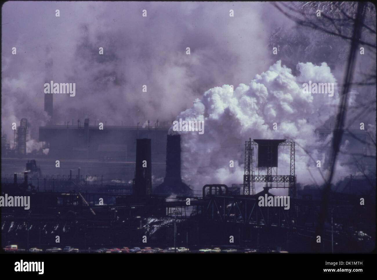 The image shows a white plume of pollutants emitted from a quenching ...