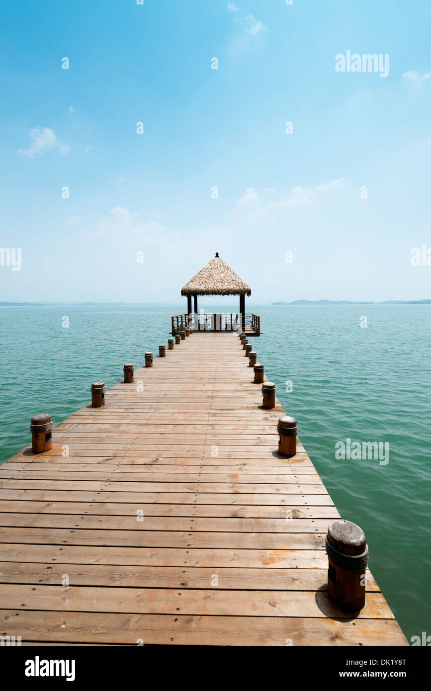 Wooden jetty over the beautiful Maldivian sea with blue sky Stock Photo ...