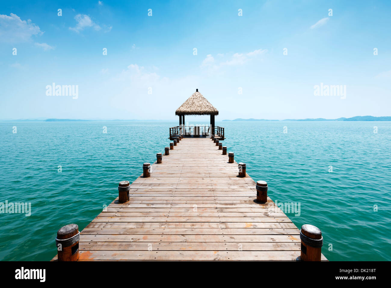 Wooden jetty over the beautiful Maldivian sea with blue sky Stock Photo ...