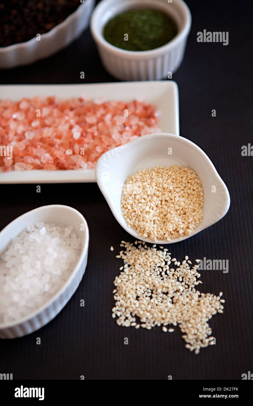 High angle view of cooking salt and spice ingredients in small bowls ...
