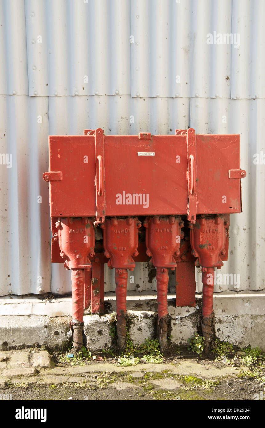 Old red electric junction box labelled electrical supply disconnected ...