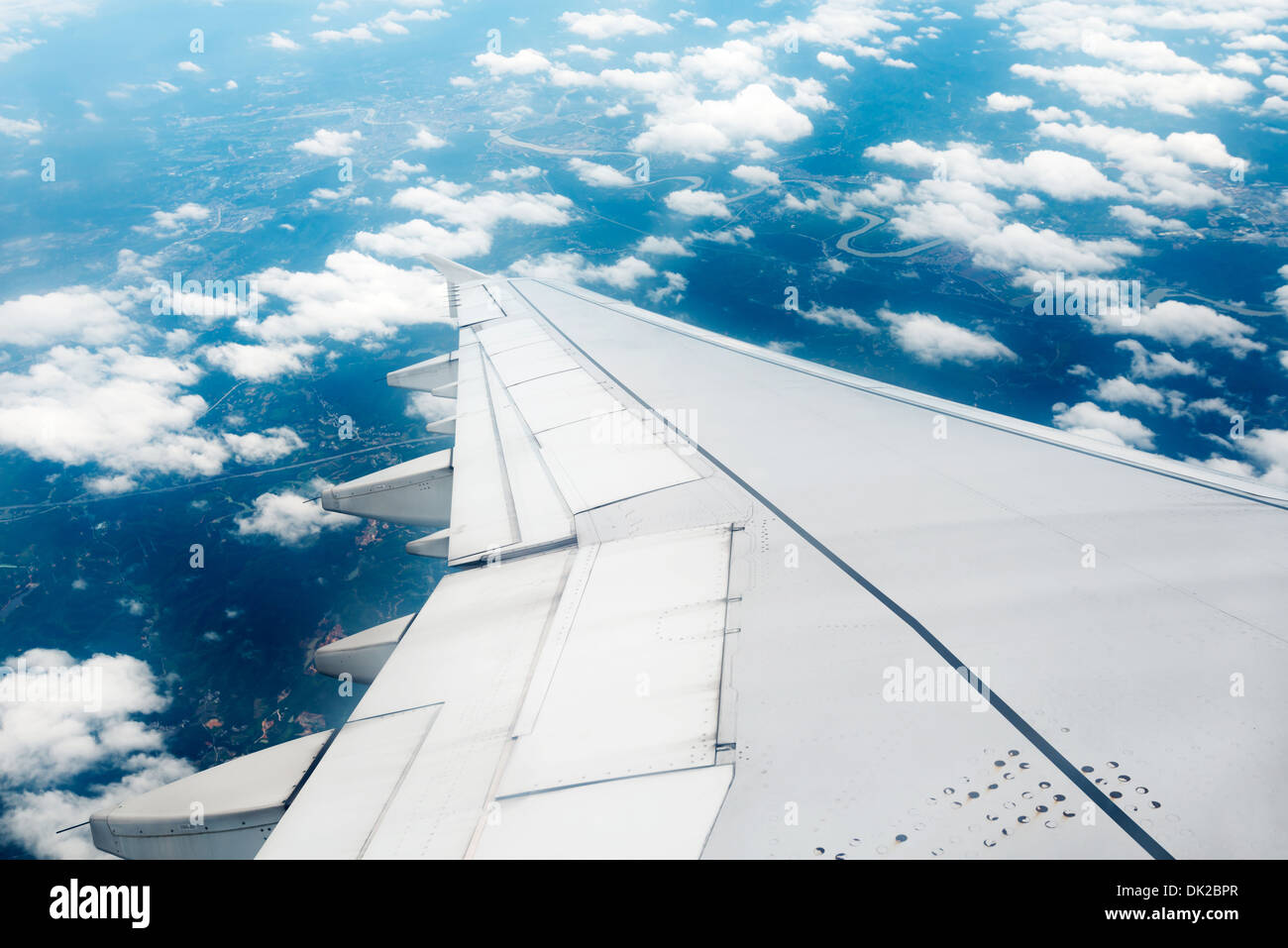 Wing aircraft in altitude during flight Stock Photo - Alamy