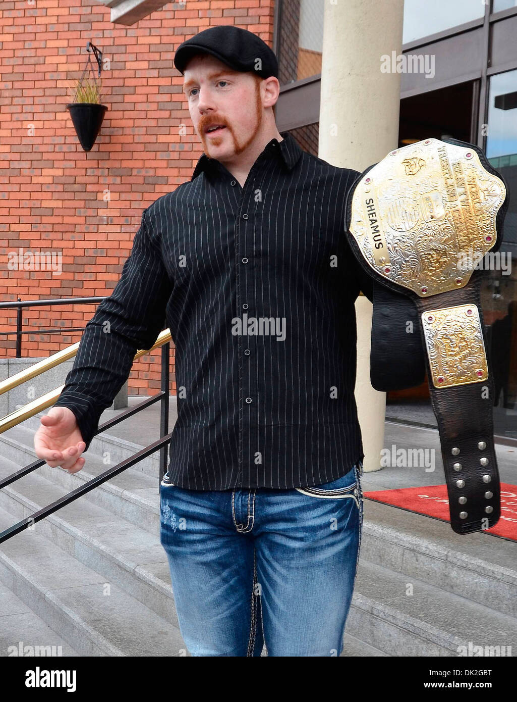 Irish grappler Sheamus shows off his new WWE World Heavyweight title on ...