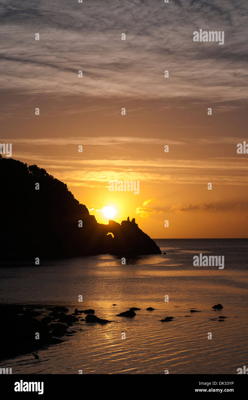 sunrise over Torquay,Devon,a natural arch of limestone called London ...