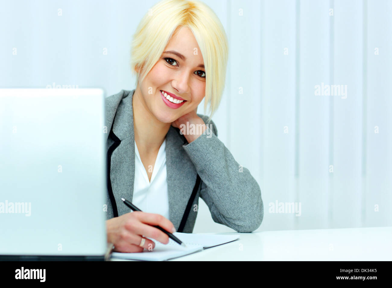 Female employee signing document in hi-res stock photography and images ...