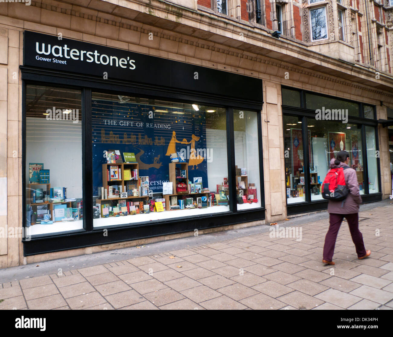 Person walking past Waterstones Book Store exterior Gower Street London ...