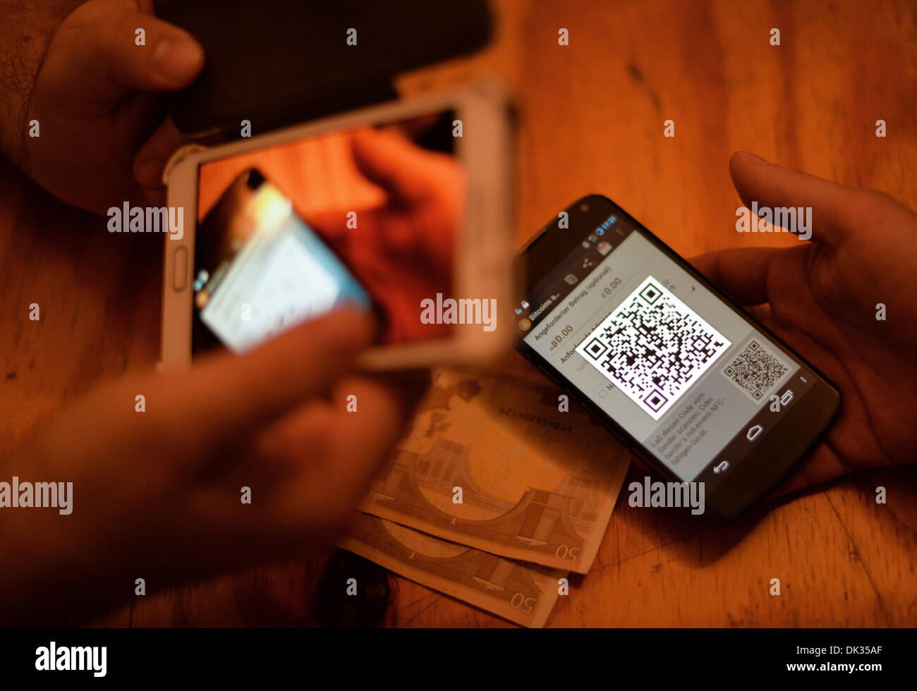 Smartphones are used for the Bitcoin trade by scanning QR codes for the ...