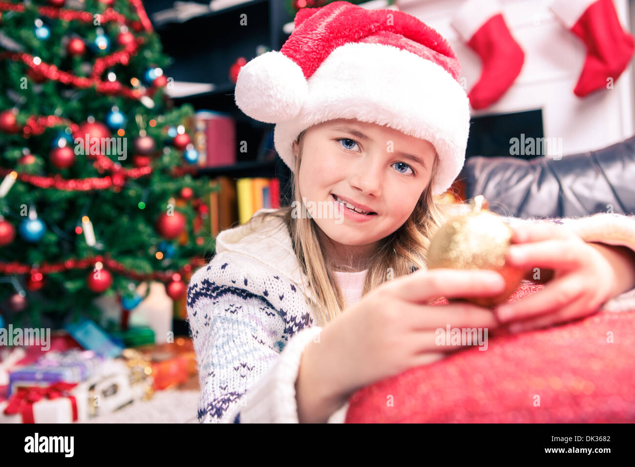 a little girl getting a Christmas gift Stock Photo - Alamy