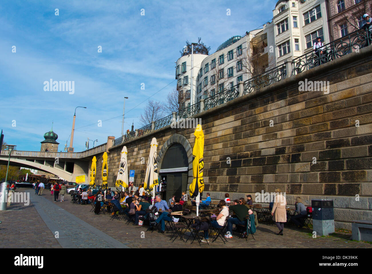Cafe bar terrace along Rasinovo nabrezi riverside promenade Nove mesto ...