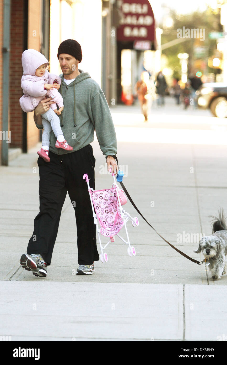 Jason Hoppy and his daughter Bryn take their dog for a walk in ...