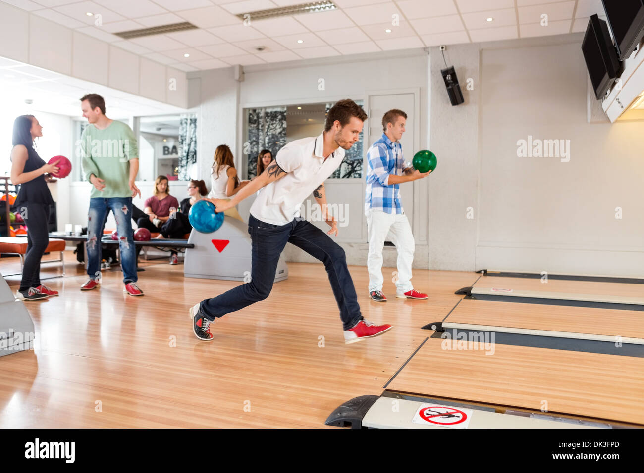 People Playing in Bowling Alley Stock Photo - Alamy