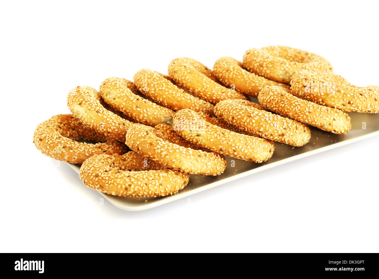 Round rusks with sesame seeds on tray Stock Photo - Alamy