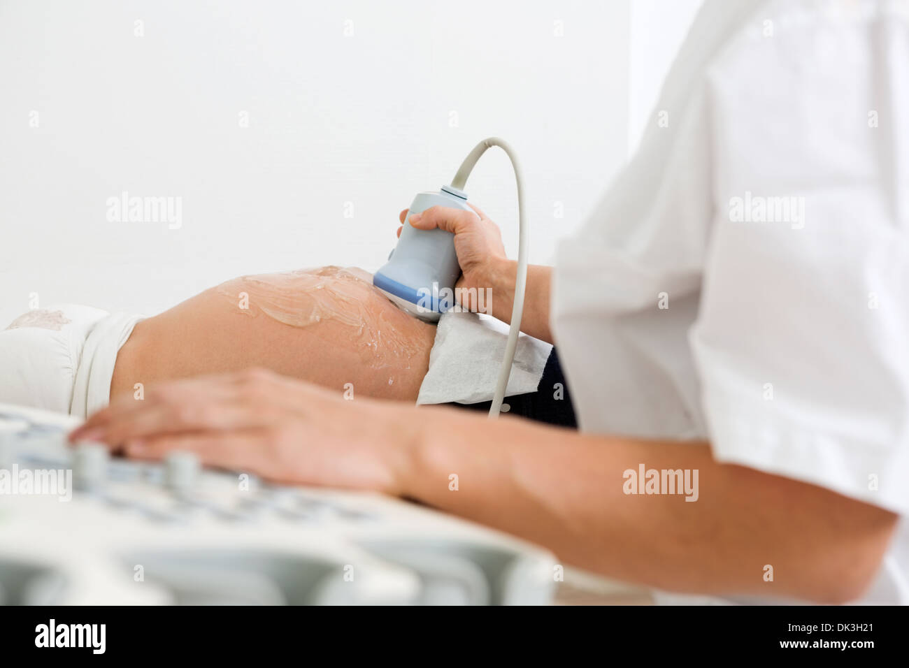 Doctor Examining Pregnant Belly By Ultrasonic Scan Stock Photo - Alamy