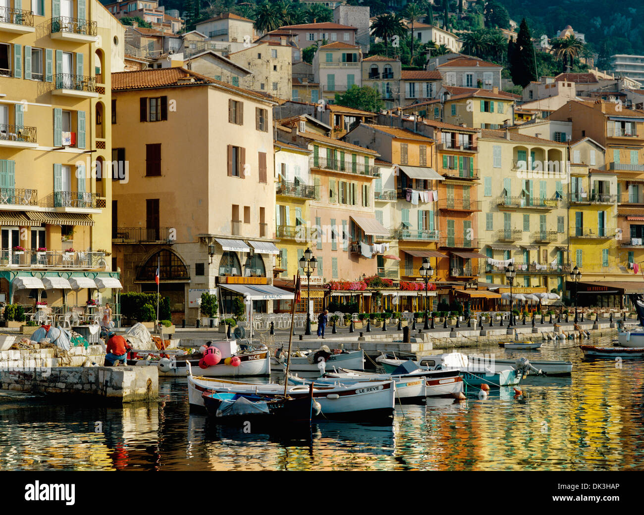 Boats in harbour showing colourful house facades on waterfront ...