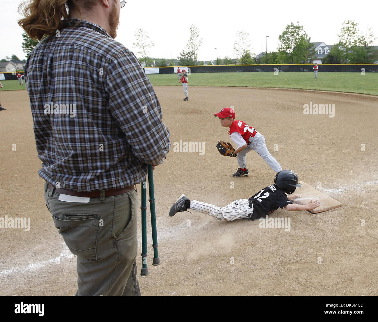 Mar. 8, 2011 - Adam Bender made an all-out effort for a hit by sliding ...