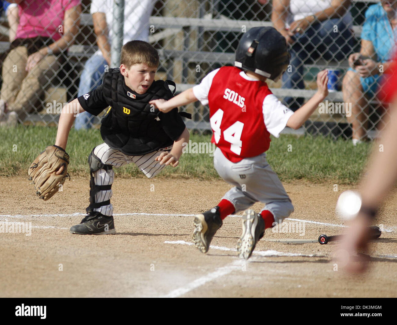 Mar. 8, 2011 - Catcher Adam Bender, left, tagged out Neil Solis with ...