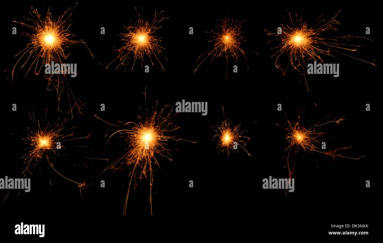 Set of burning sparklers isolated on black background. Small fireworks ...