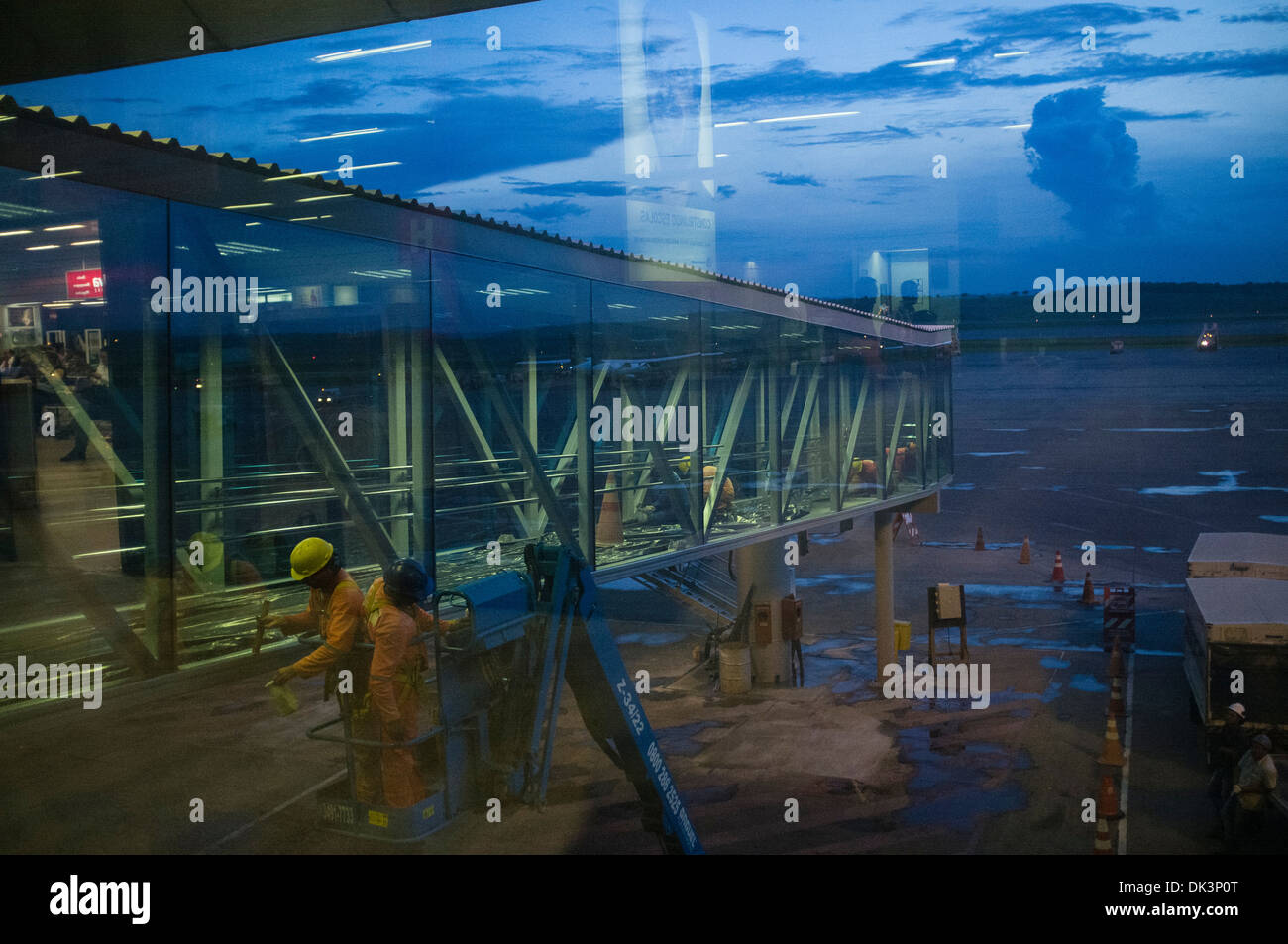 Workers do maintenance on jet bridge in Confins Airport in Belo ...