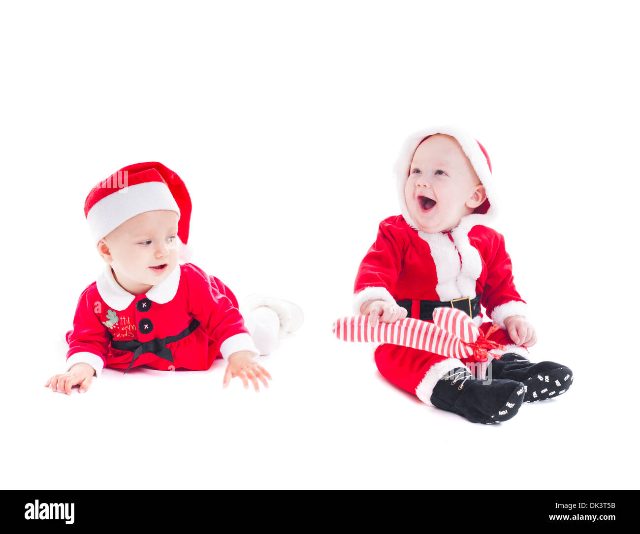 Adorable Santa babies - boy and girl isolated on white Stock Photo - Alamy