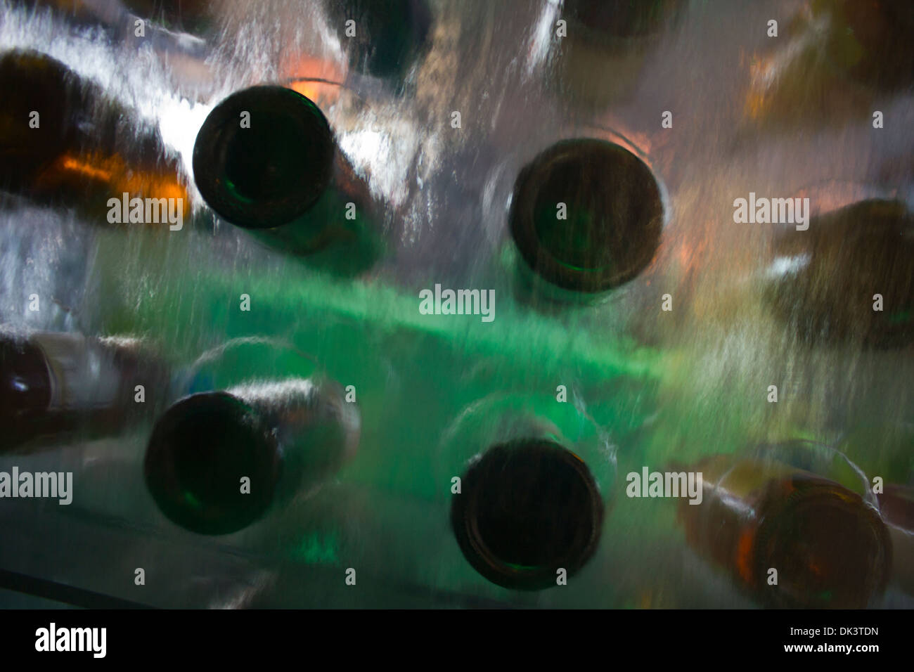 Glass Wine Waterfall - Abstract of Wine Bottles placed behind a ...