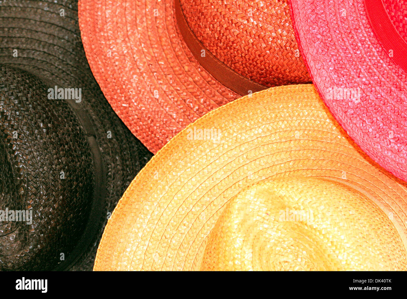 Red, Bronze, Cinnamon and Black,Colored Plaited Straw Hats Fill the ...