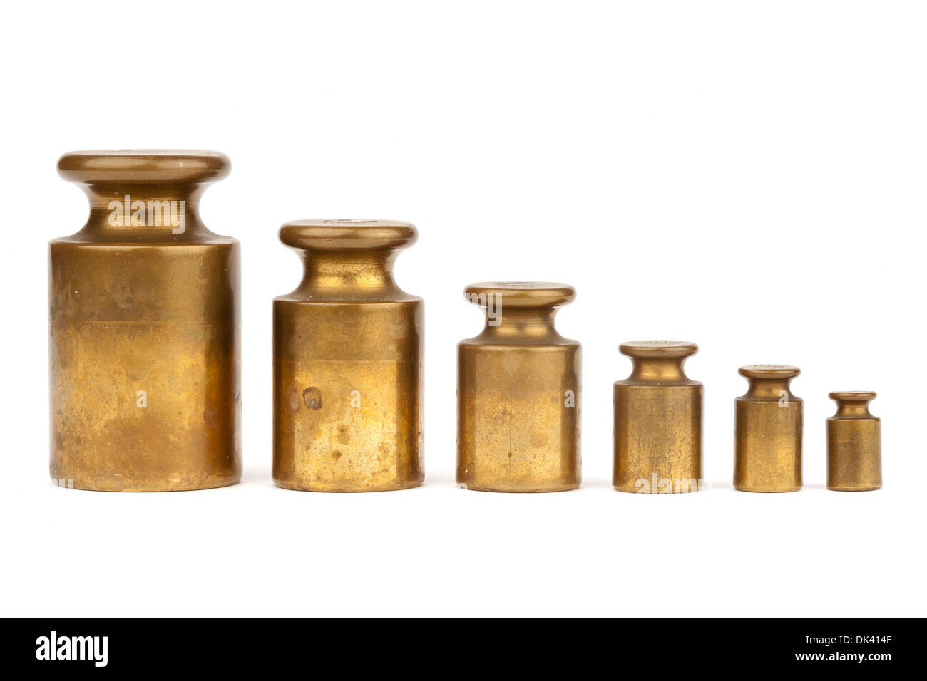 Row of old brass weights, scales Stock Photo - Alamy