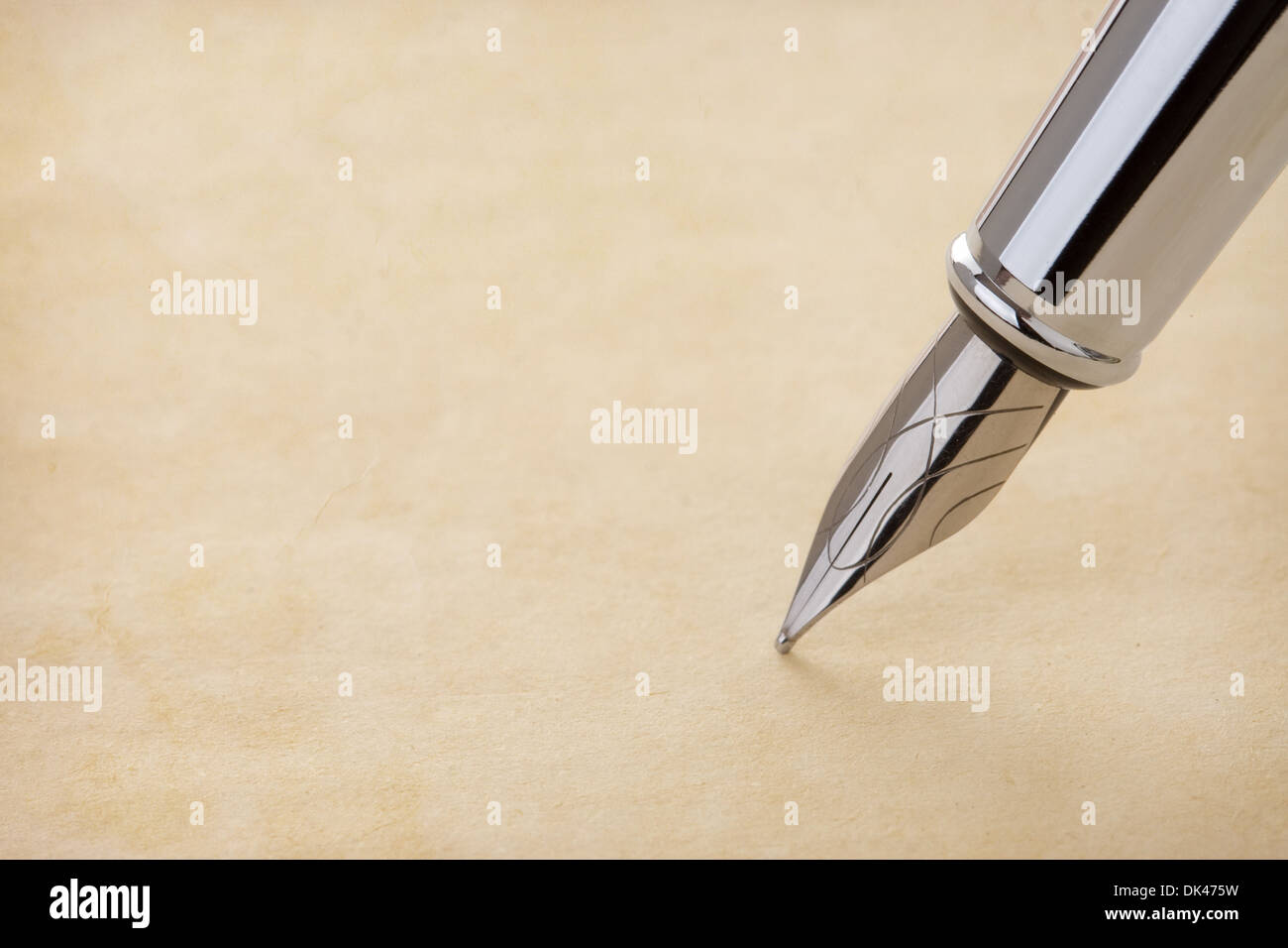 ink pen and parchment background Stock Photo - Alamy