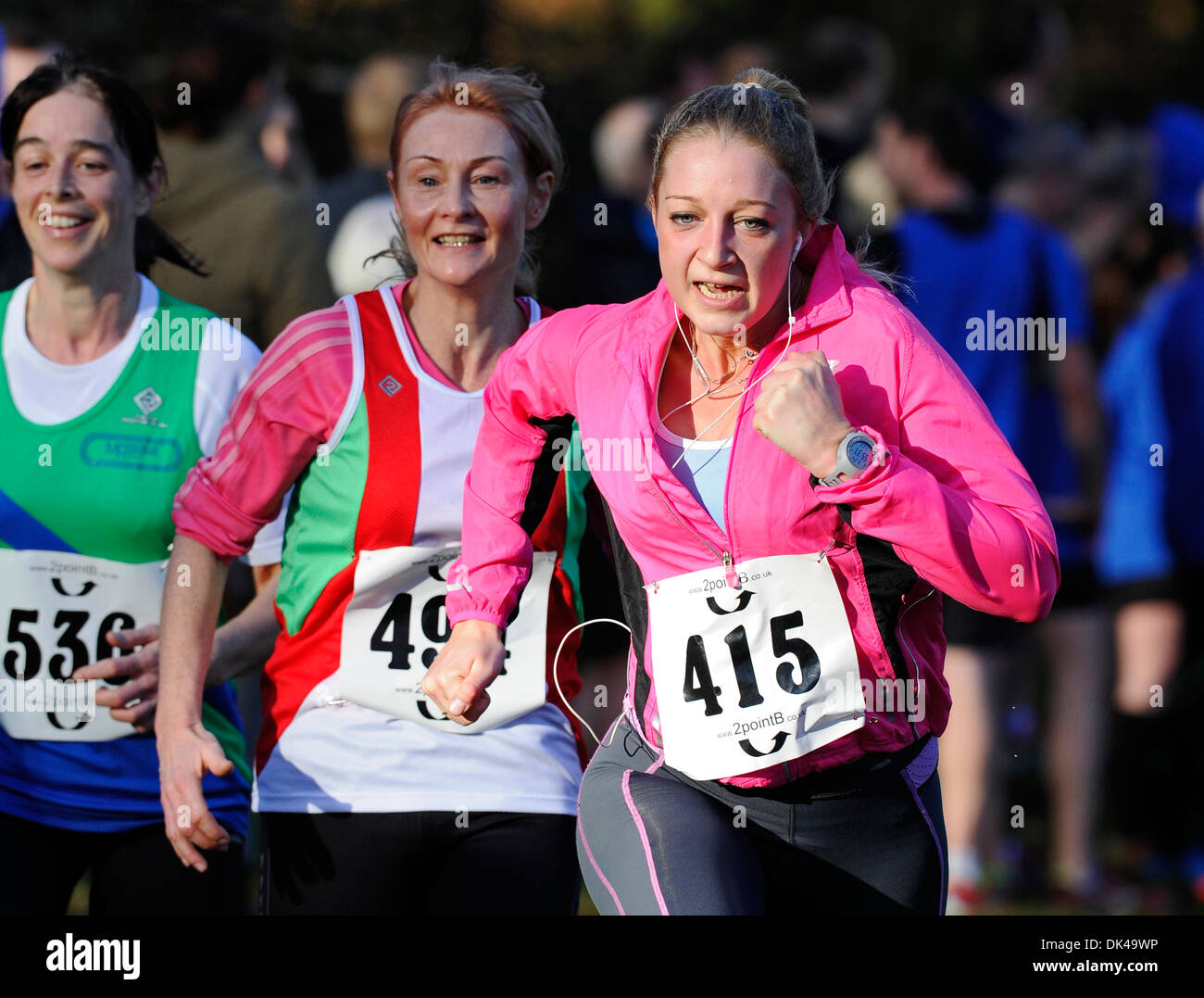 Three female runners sprinting to the finish line Stock Photo - Alamy