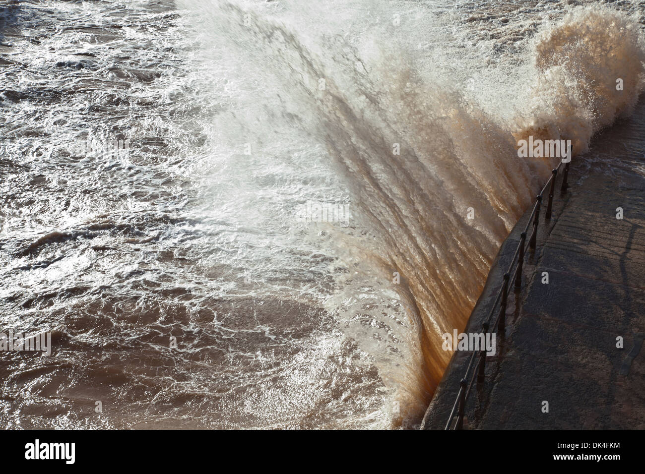 WAVE BREAKING AGAINST PROMENADE WALL Stock Photo - Alamy