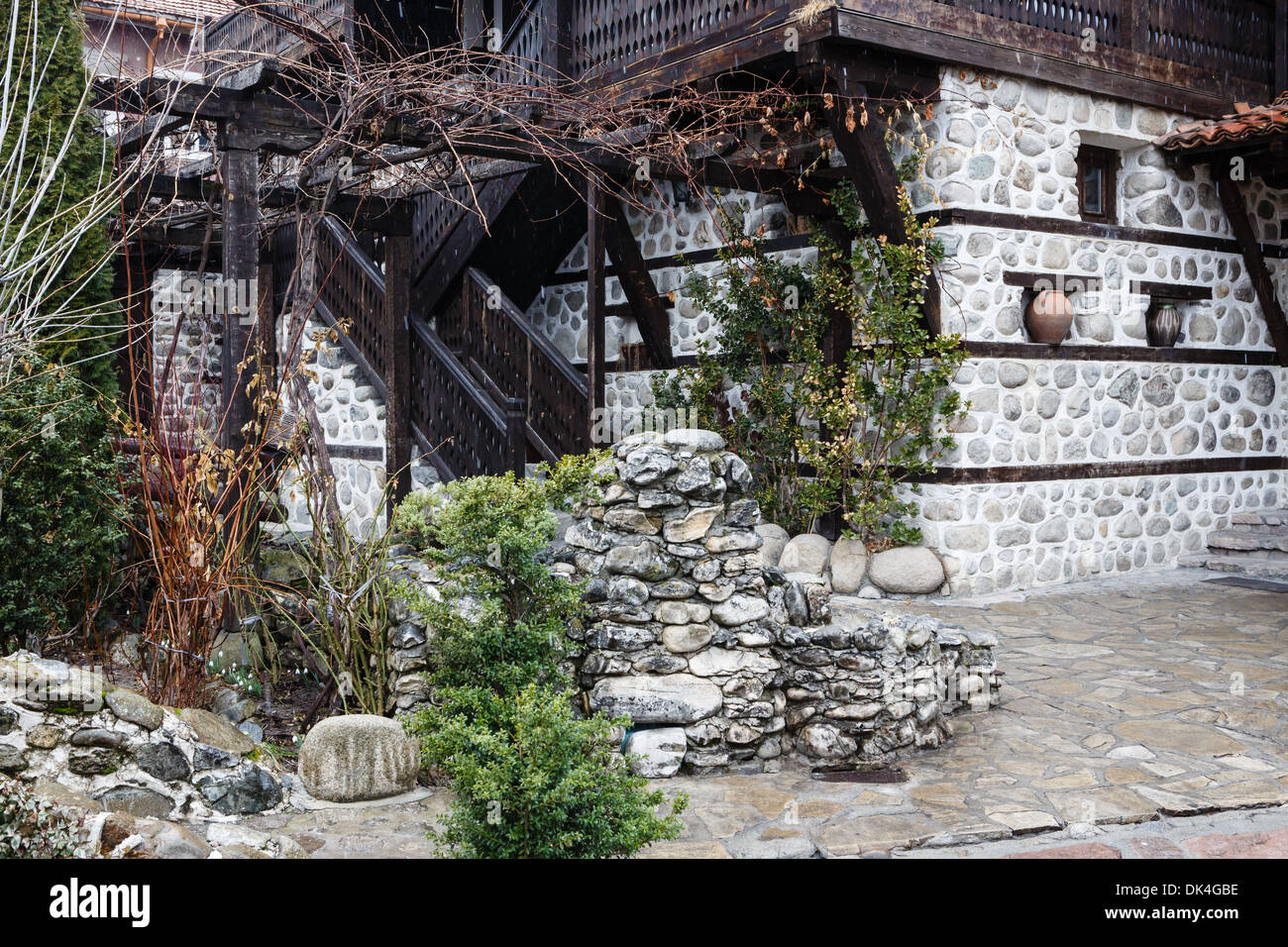 Decorative garden in the yard of the ancient house Stock Photo - Alamy