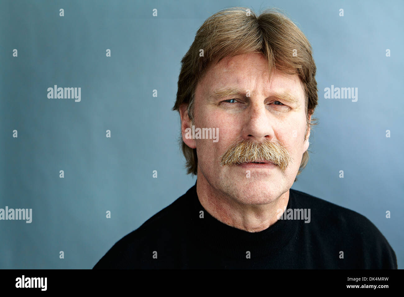 Portrait of man looking at camera Stock Photo - Alamy