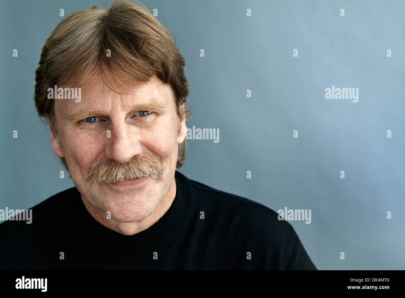 Portrait of man looking at camera Stock Photo - Alamy