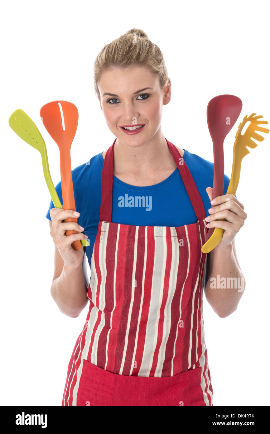 Model Released. Attractive Young Woman Holding Cooking Utensils Stock ...