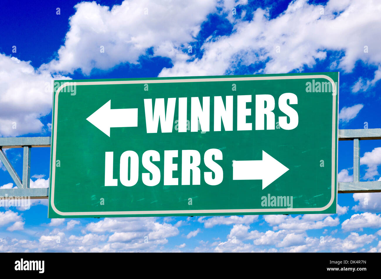 Winners and losers sign on the green board with clouds in background ...