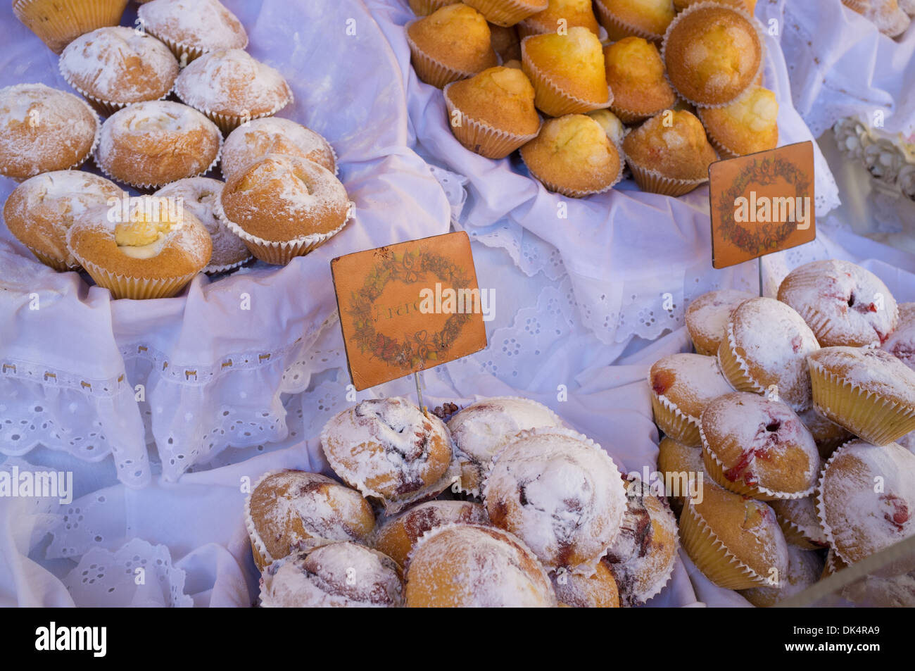Assorted muffins on display on a traditional street market stall Stock ...