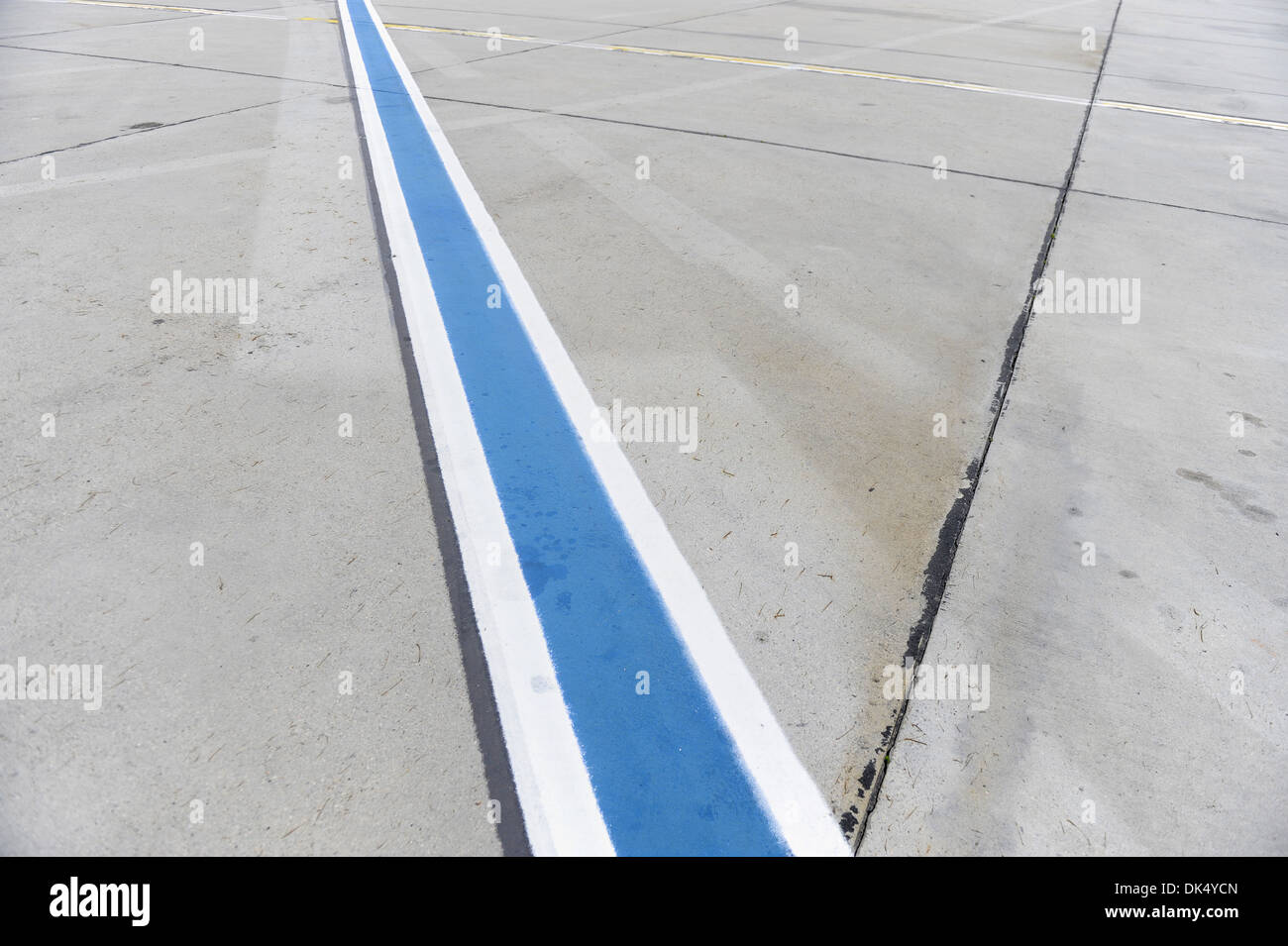 Blue and white stripe runway marking Stock Photo - Alamy