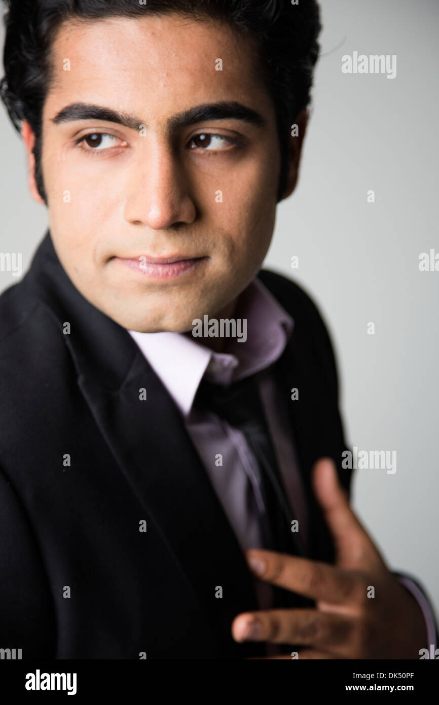 Professional young Indian man looking away Stock Photo - Alamy