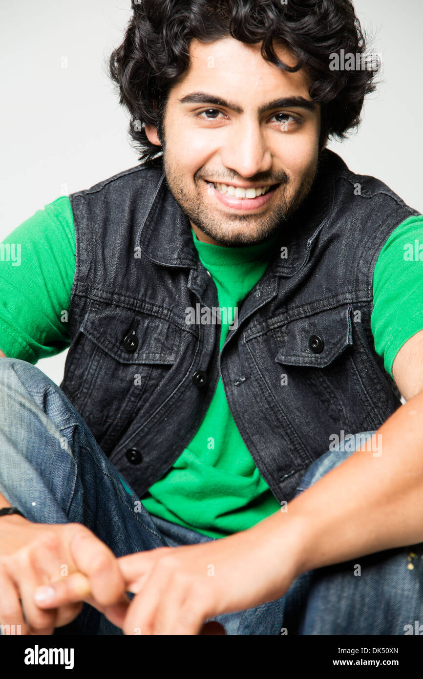 Smiling young Indian man Stock Photo - Alamy