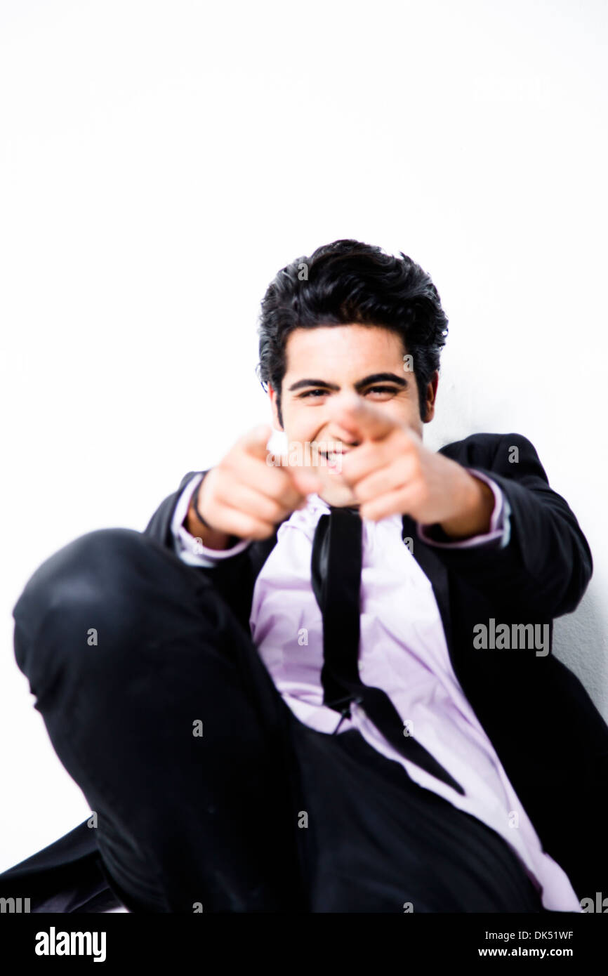 Smiling young indian man fingers hi-res stock photography and images ...