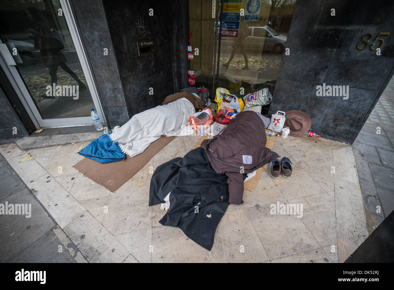 Rough sleepers in a doorway during the day. Green Park, London, UK ...